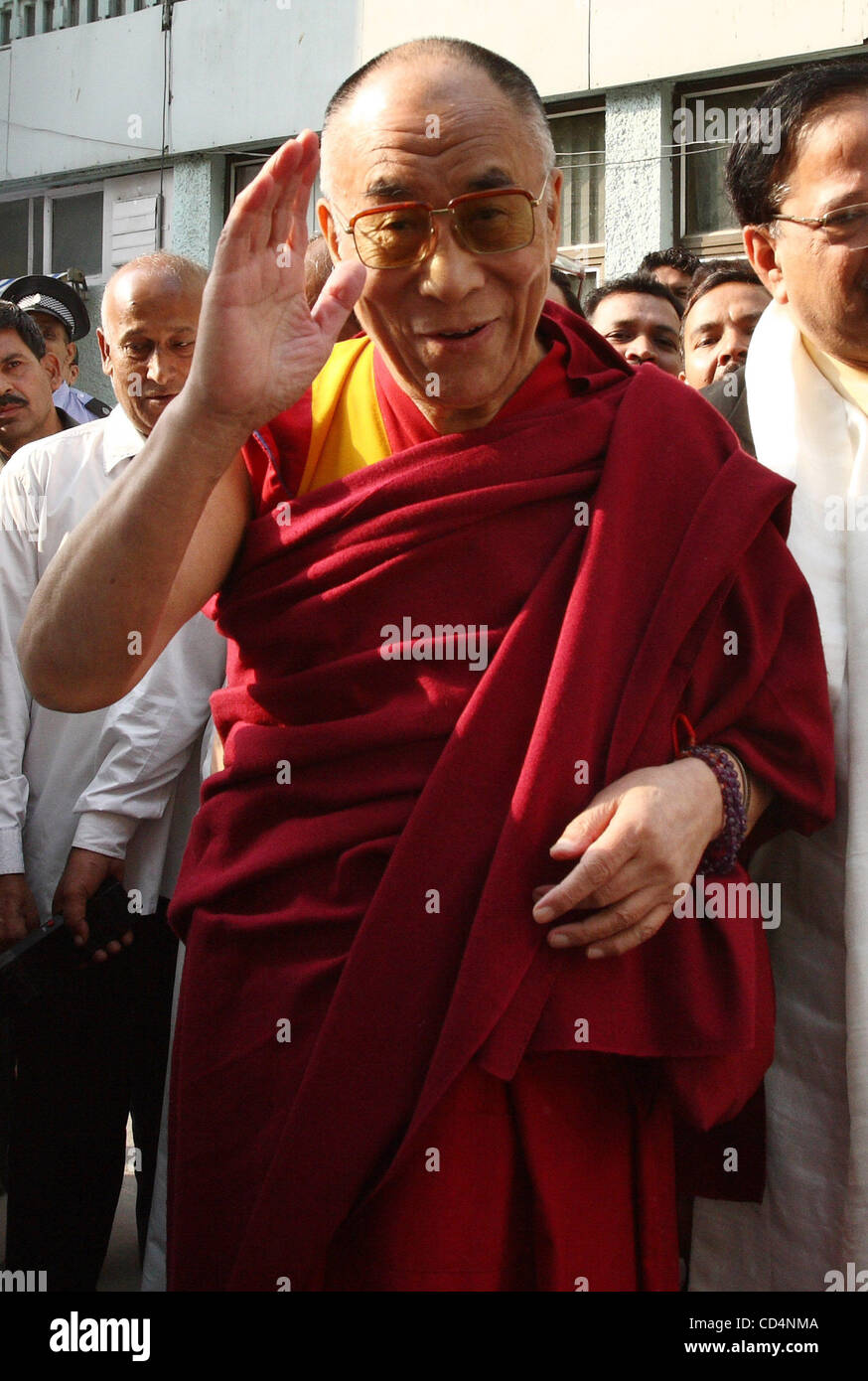 Tibetan spiritual leader the Dalai Lama waves as he leaves the Ganga ...