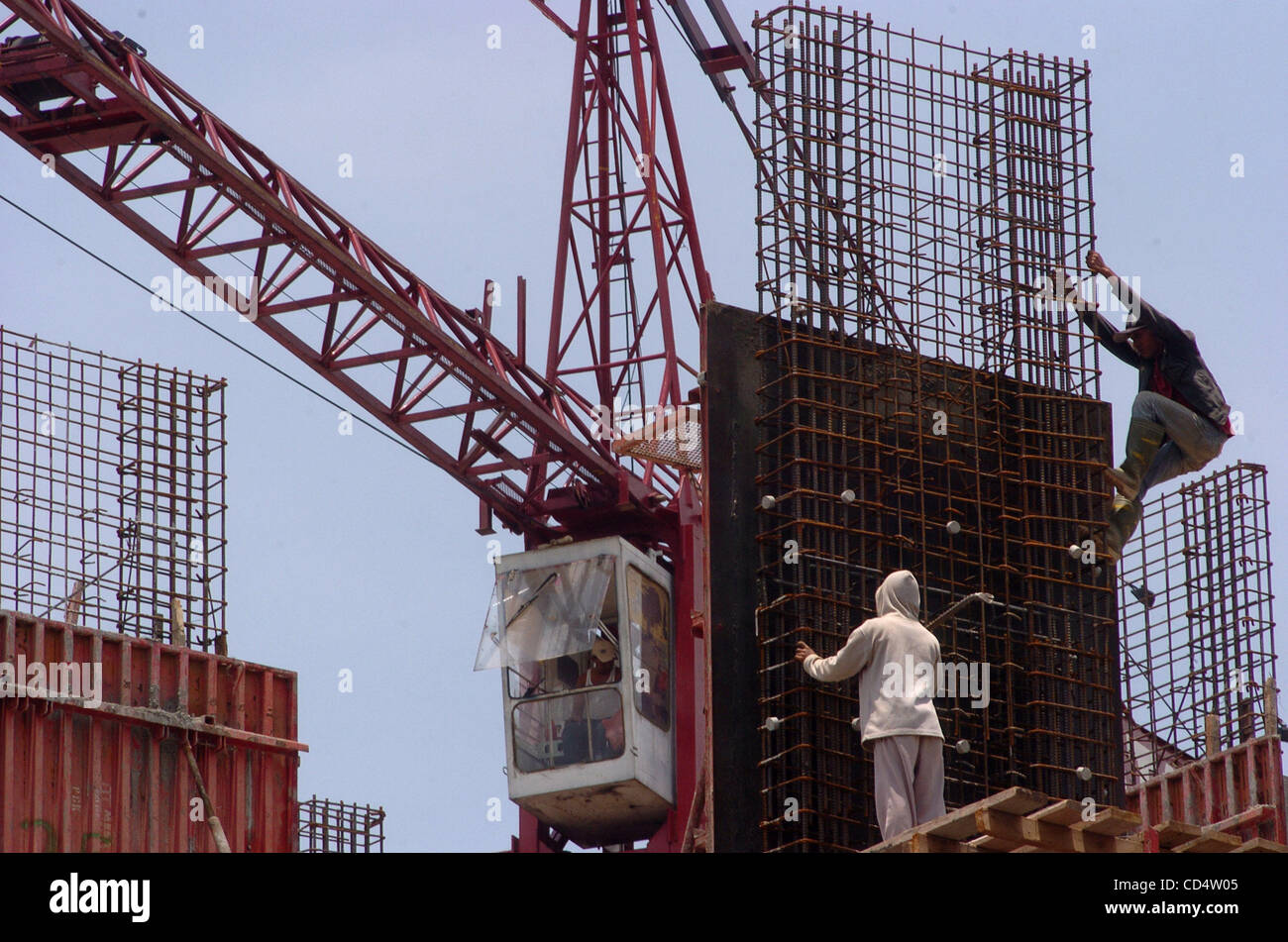 Construction labourers works at a building site in downtown Jakarta ...
