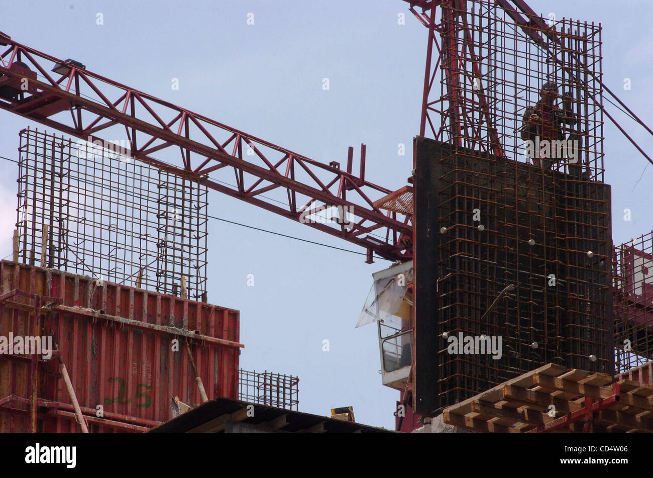 Construction labourers works at a building site in downtown Jakarta ...