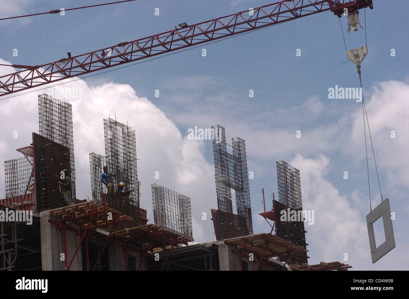Construction labourers works at a building site in downtown Jakarta ...
