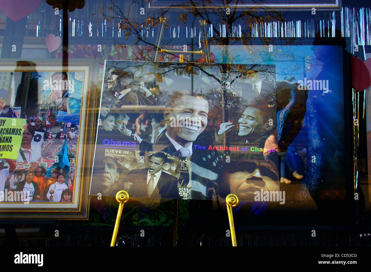 A Barack Obama poster in a store front window across from Grant Park in ...
