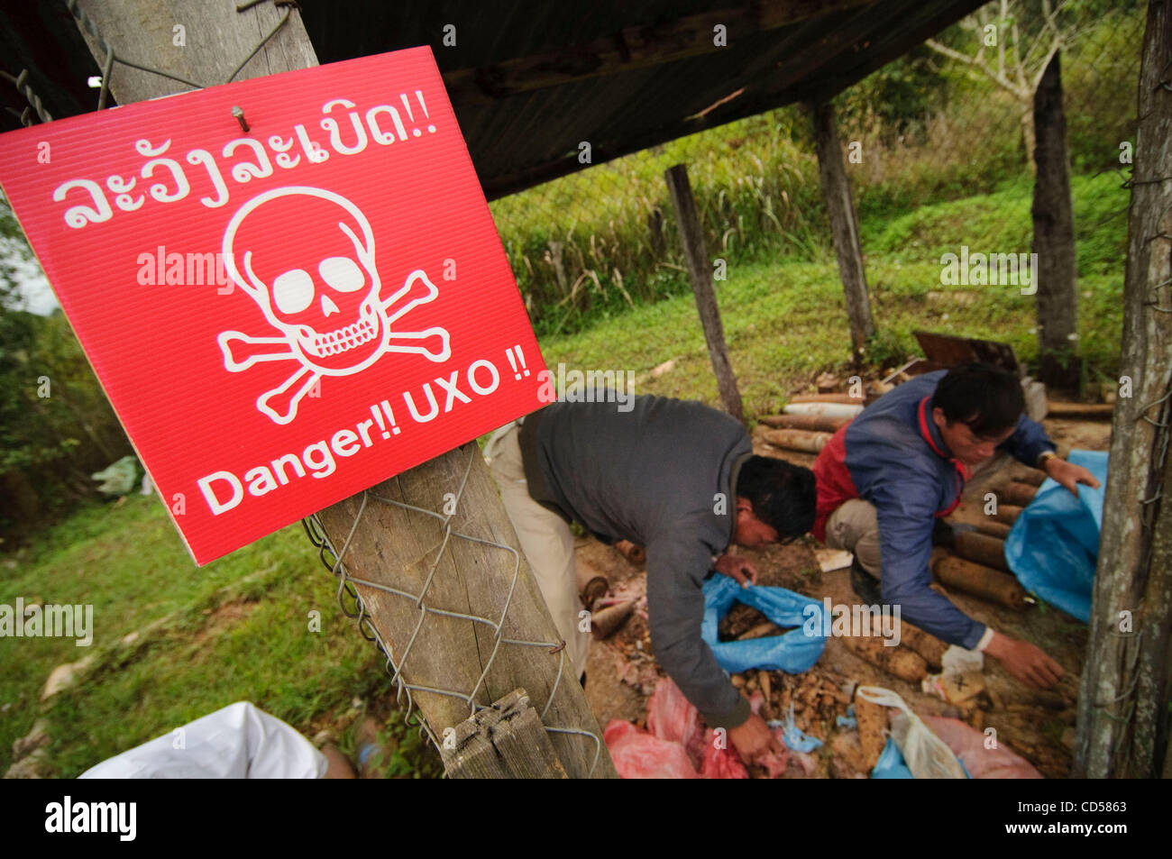 Un exploded ordnance sign at UXO Laos Bomb disposal organisation's ...