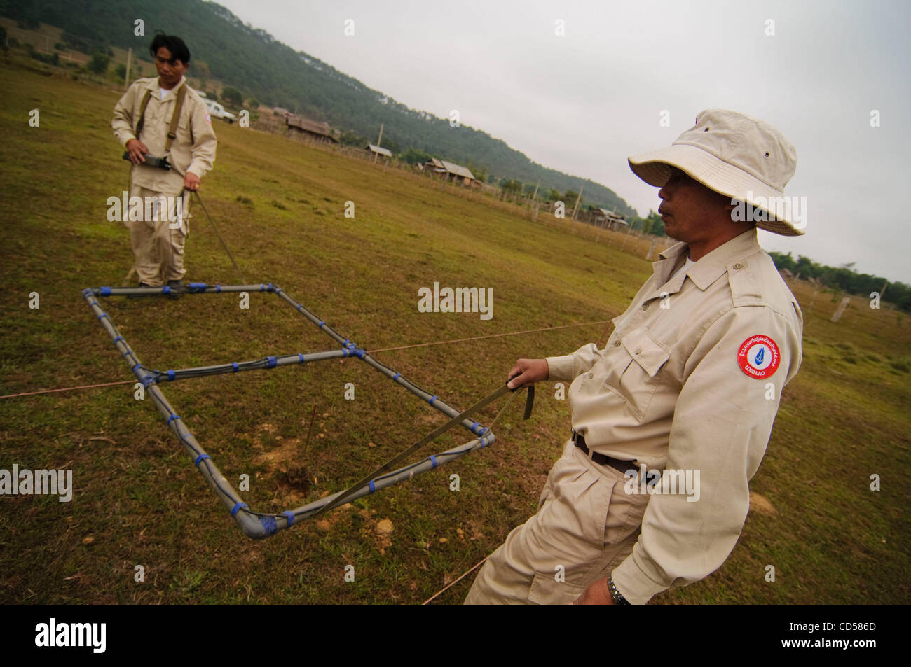 UXO Laos bomb disposal personnel using an Ebinger UPEX 740M metal ...