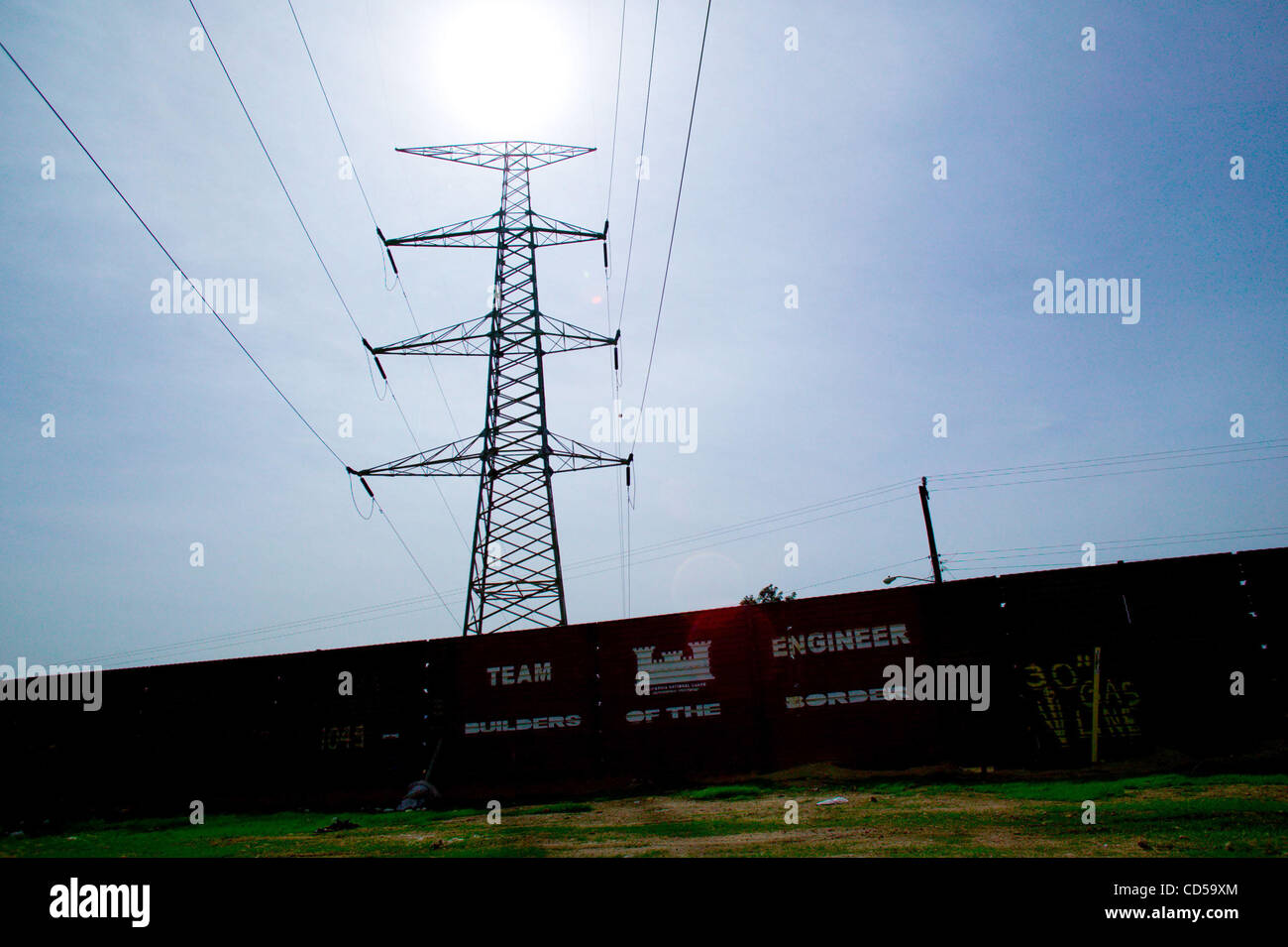 Power lines running over the American border fence near Tijuana Stock ...