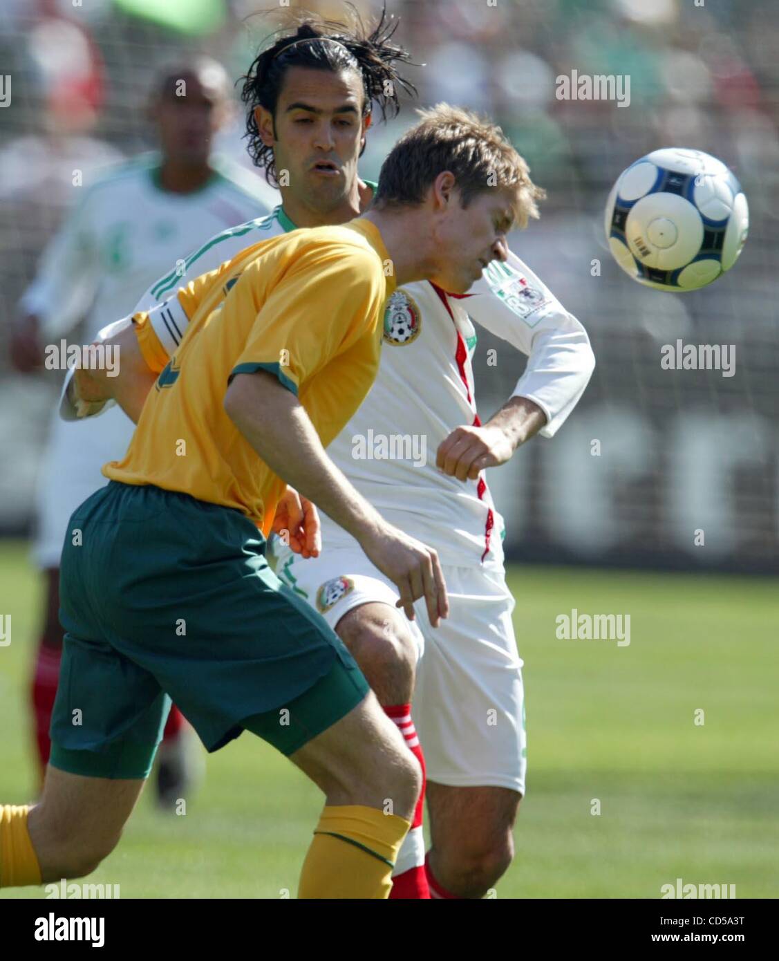 Australia's defender Adrian Leijer, left, heads the ball as Mexico's ...