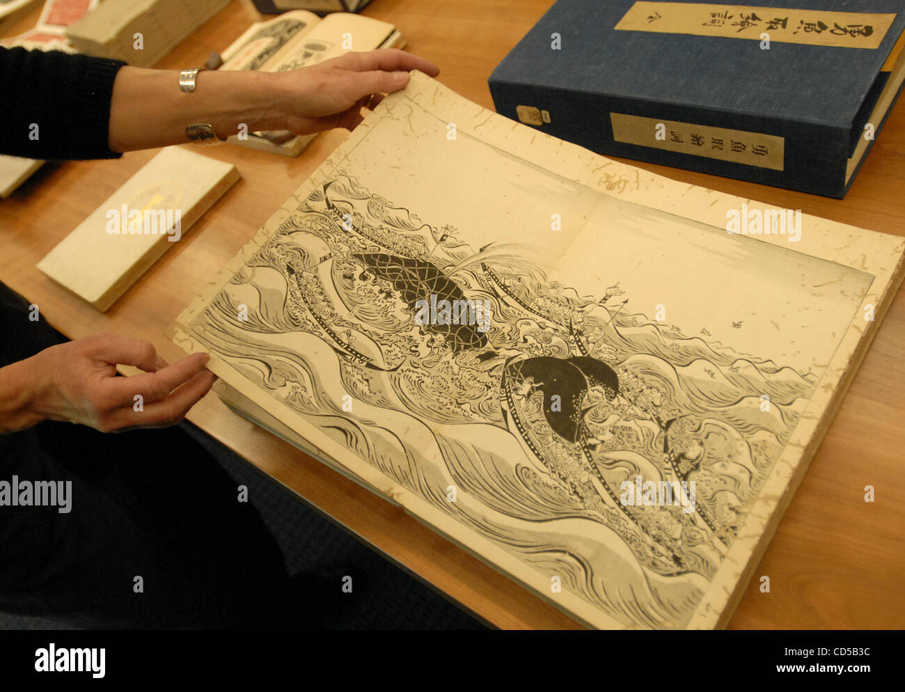 Librarian Deborah Rudolph shows an 1829 Isanatori Ekotoba by Oyamada ...