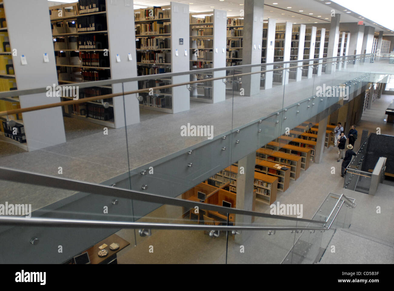 Walking through the light well of the library, Peter Zhou, director of ...