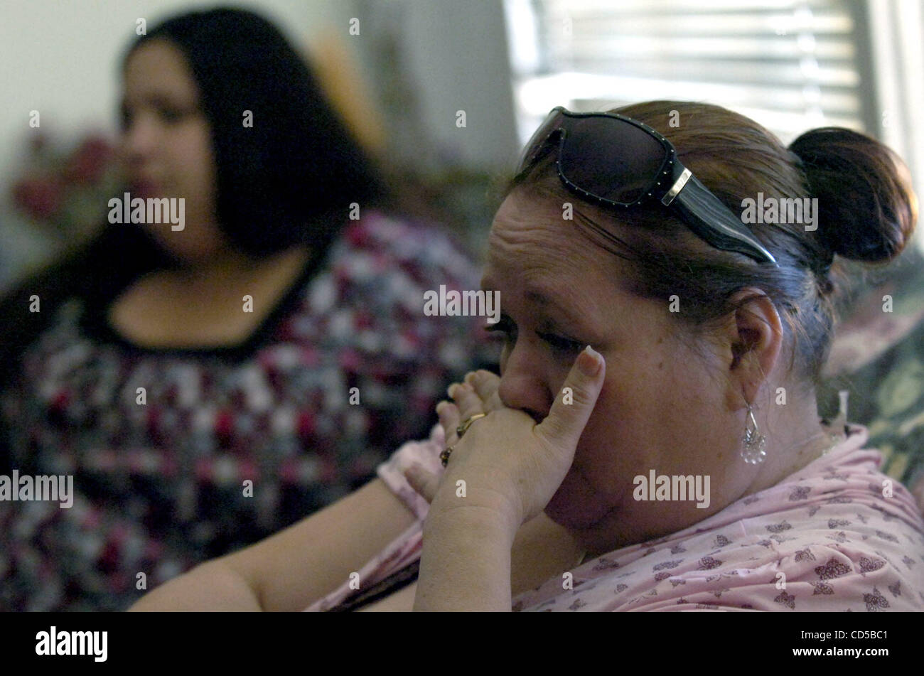 Laura Calderon, of Antioch, right, sits in her living room on Thursday ...