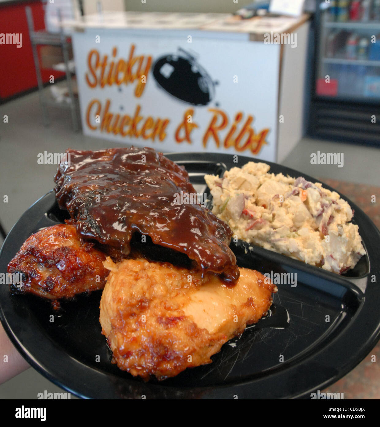 A combo plate of Ribs and Sticky Chicken at Sticky Chicken and Ribs in ...