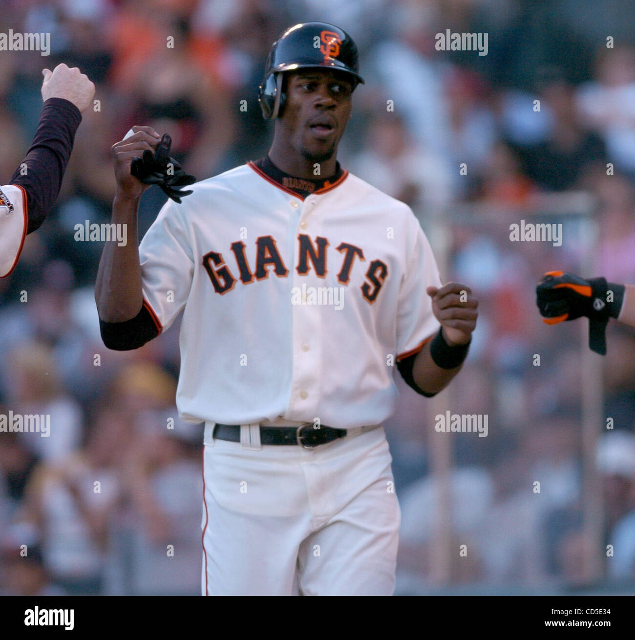 Fred Lewis (#14) of the San Francisco Giants celebrates after he scores ...