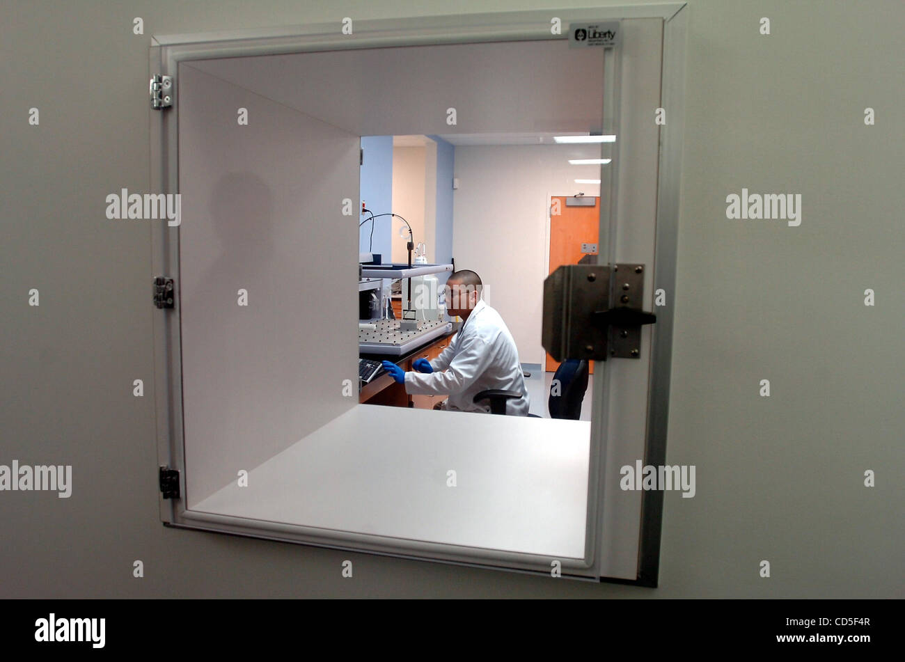 Criminalist Kevin Tsou works in the state DNA laboratory in Richmond, Calif. on Monday, May 5 ...