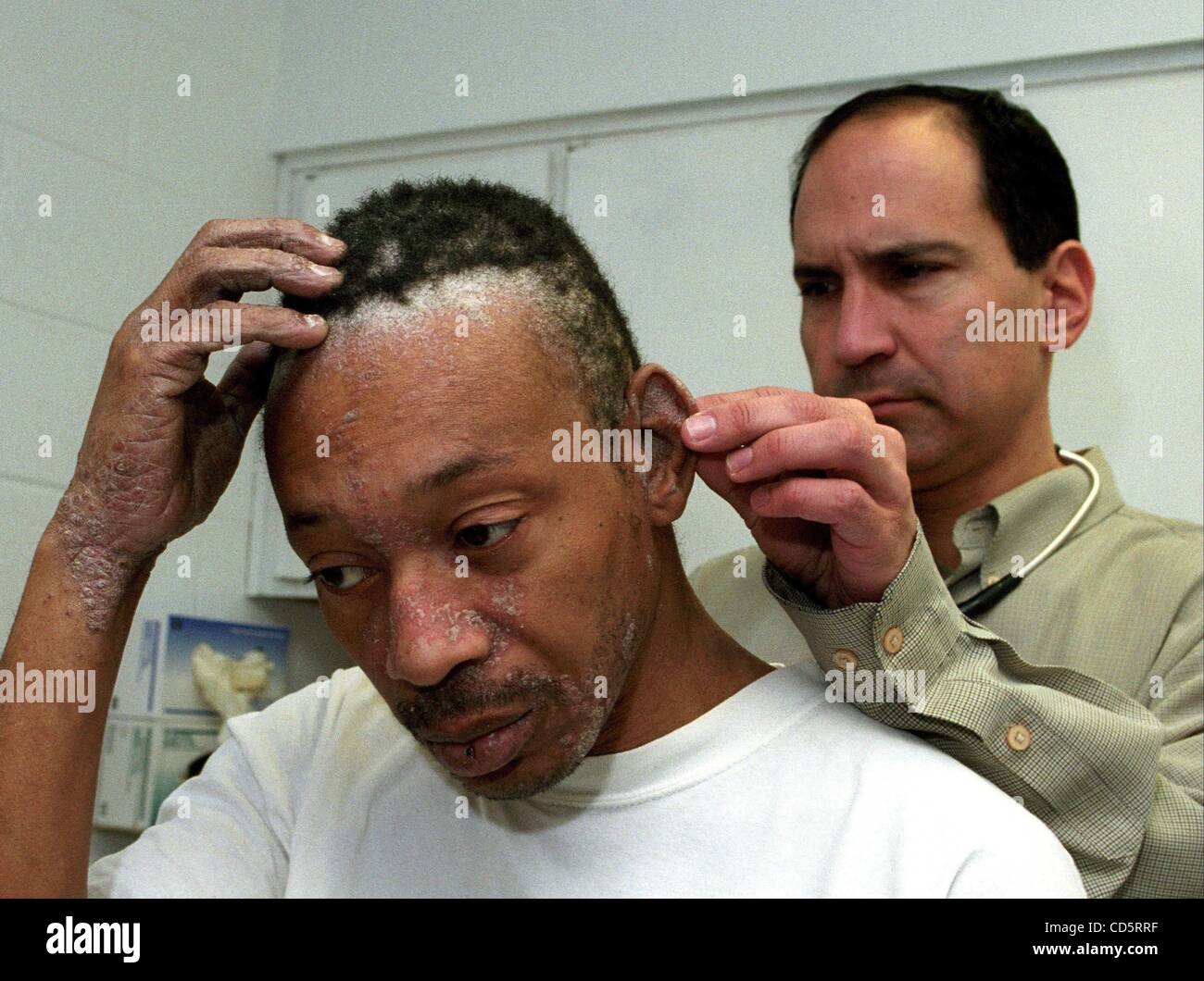 Mar. 15, 2003 - Huntsville, Alabama, U.S. - Dr. STEVE TABET examines ...