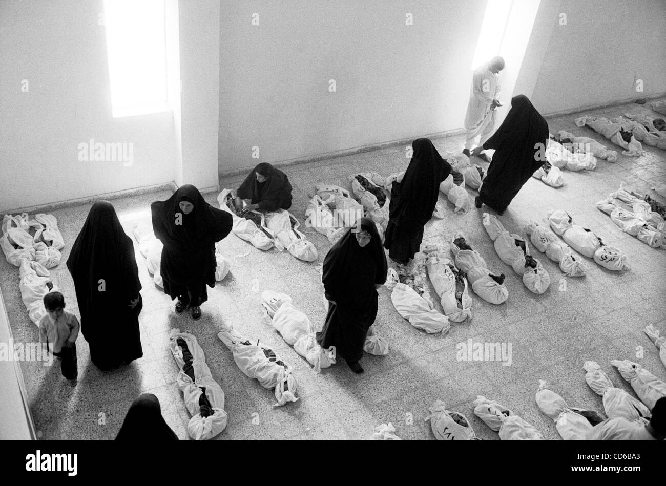 May 21, 2003 - Al-Musayab, Iraq - Bones in shrouds fill the gymnasium ...