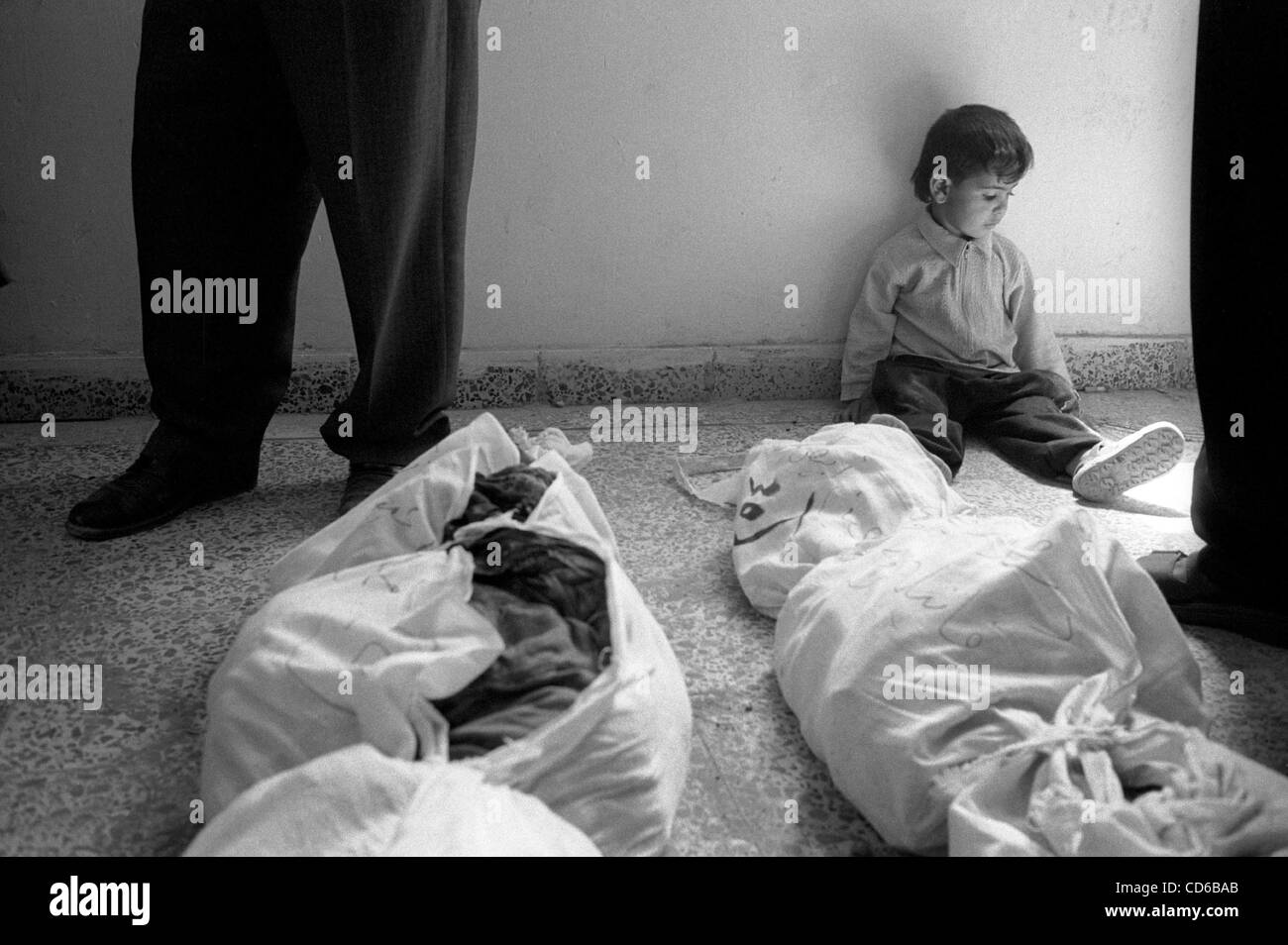 May 21, 2003 - Al-Musayab, Iraq - A boy waits for his mother who is ...