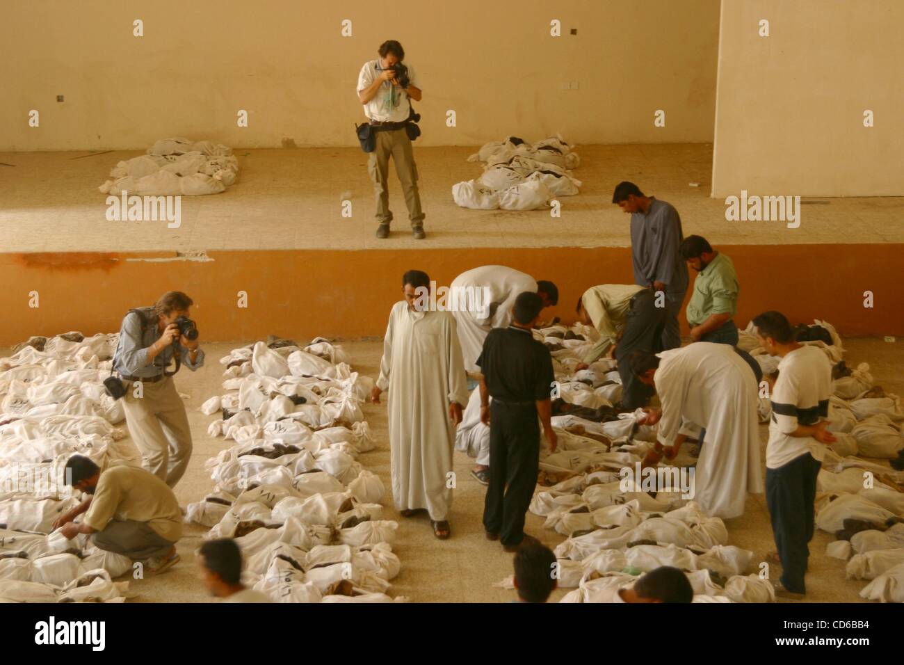 May 24, 2003 - Al-Musayab, Iraq - Bones in shrouds fill the gymnasium ...