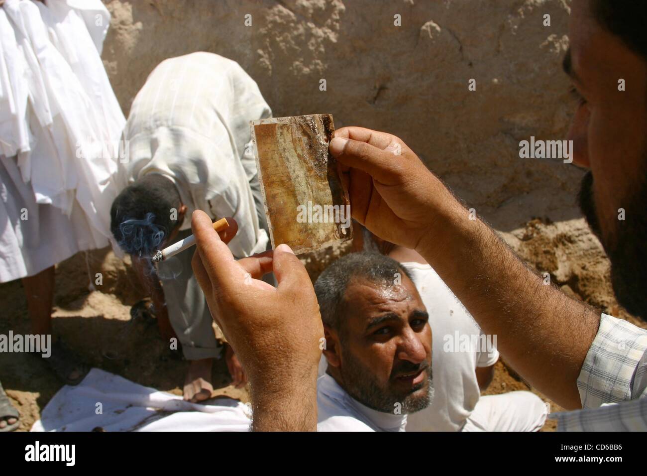 May 24, 2003 - Al-Musayab, Iraq - Exhuming remains for identification ...