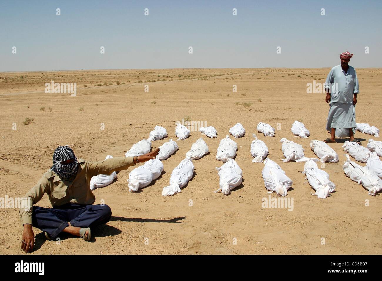 May 24, 2003 - Al-Musayab, Iraq - An array of shroud-wrapped remains ...