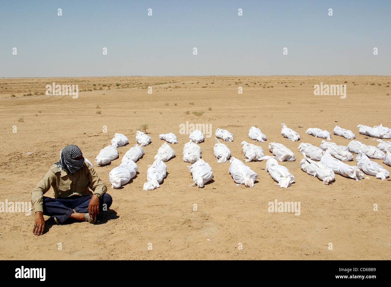 May 24, 2003 - Al-Musayab, Iraq - An array of shroud-wrapped remains ...
