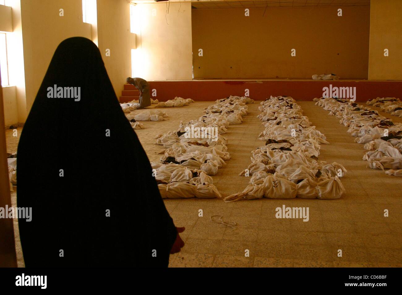 May 24, 2003 - Al-Musayab, Iraq - Bones in shrouds fill the gymnasium ...
