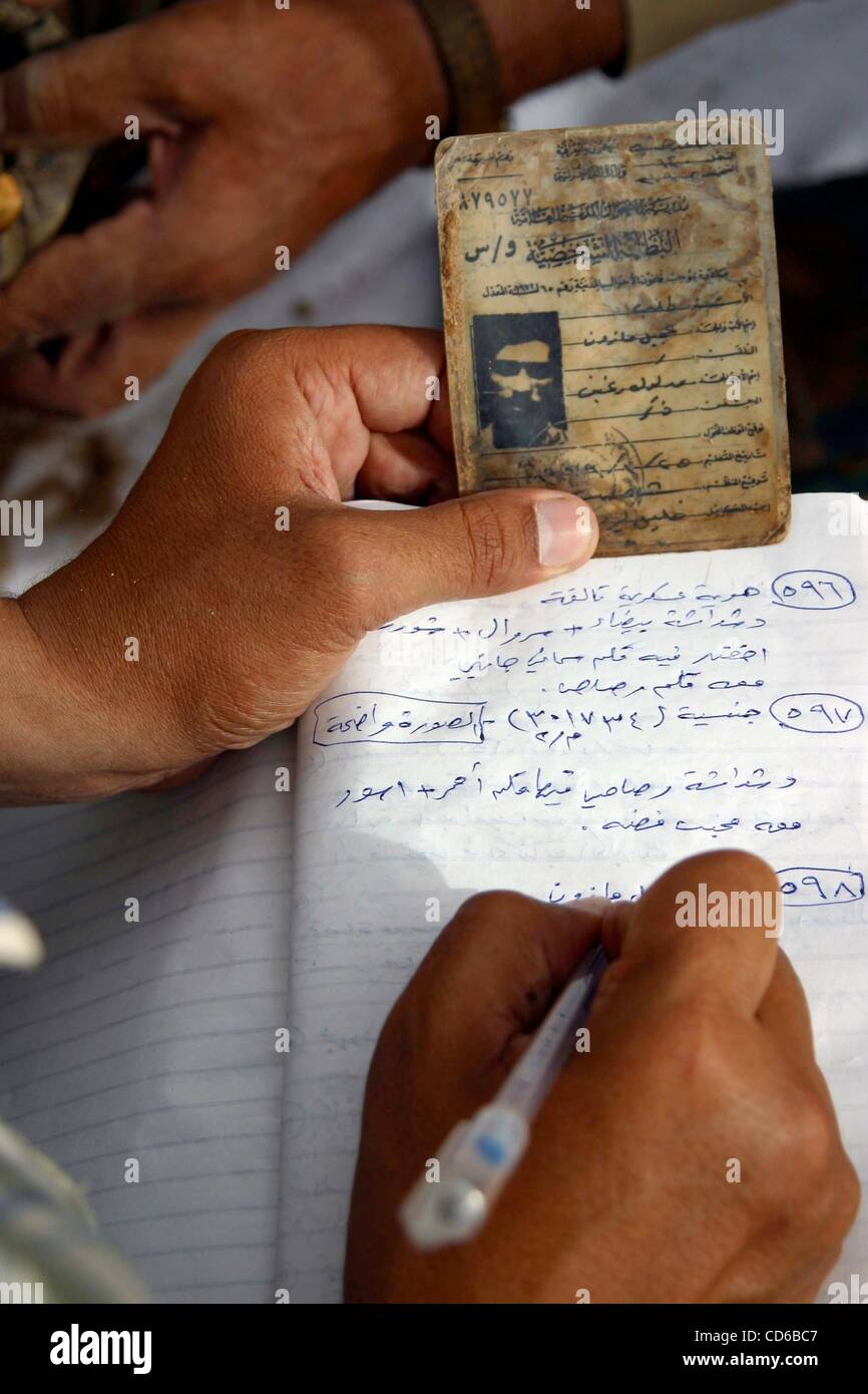 May 28, 2003 - Al-Musayab, Iraq - Recording an identification card at ...