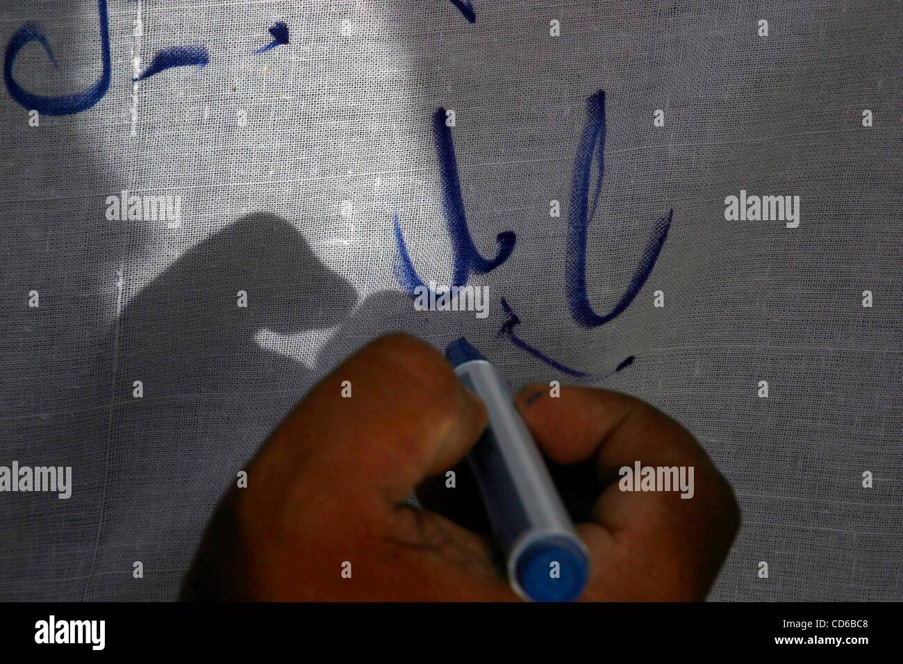 May 28, 2003 - Al-Musayab, Iraq - Diggers write number codes in Arabic ...