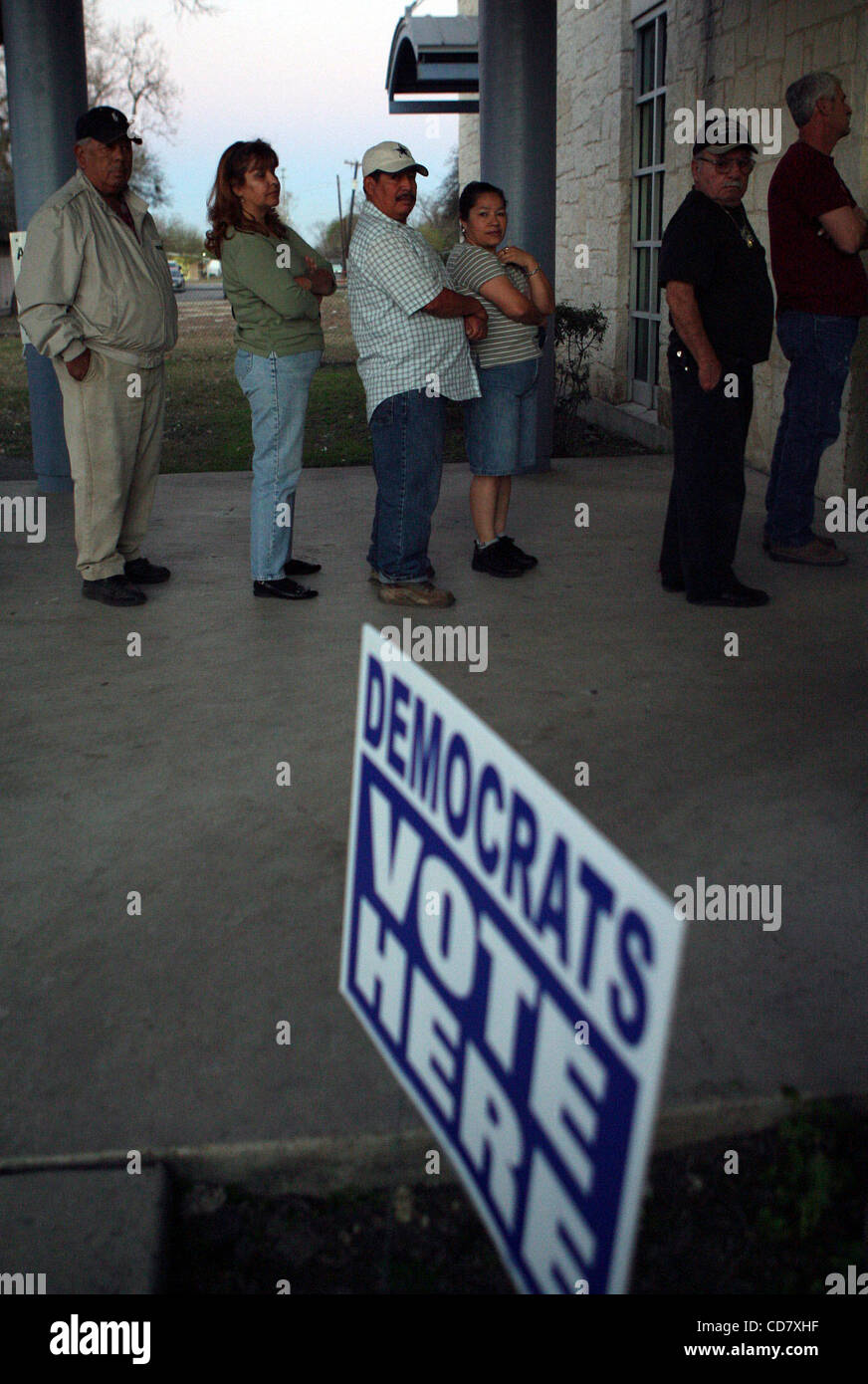 METRO-People wait in line outside Collier Elementary school as the ...