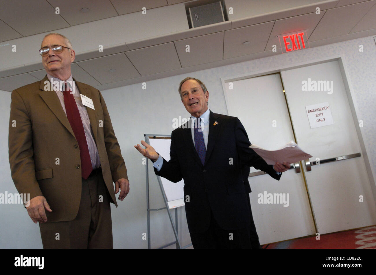 Charles Powers (L) Chair, Harbor Consortium looks on as Mayor Michael ...