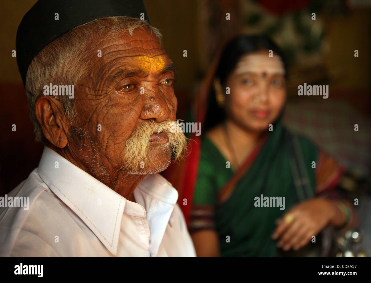 Oct 10, 2008 - Saundatti, India - Radhabai Madar Mudalagi (right) looks ...