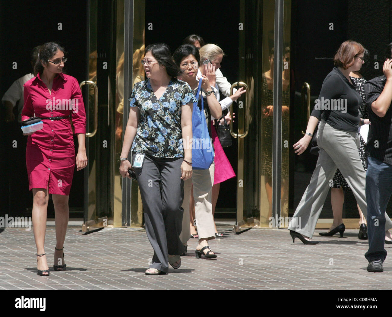 People leave the building after work in downtown Los Angeles. (Photo by ...
