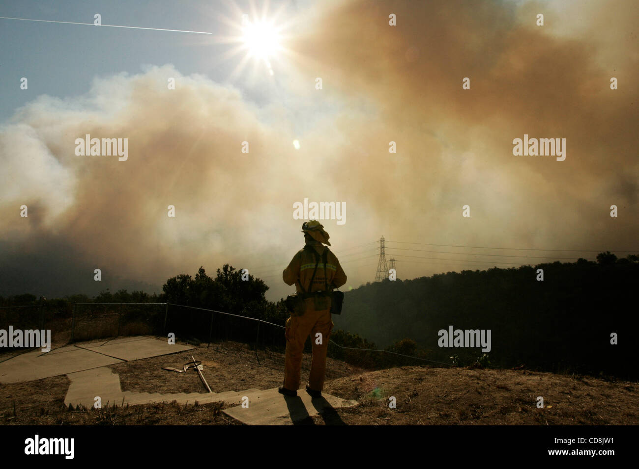 Nov 16, 2008 - Diamond Bar, California, USA - A firefighter monitors ...