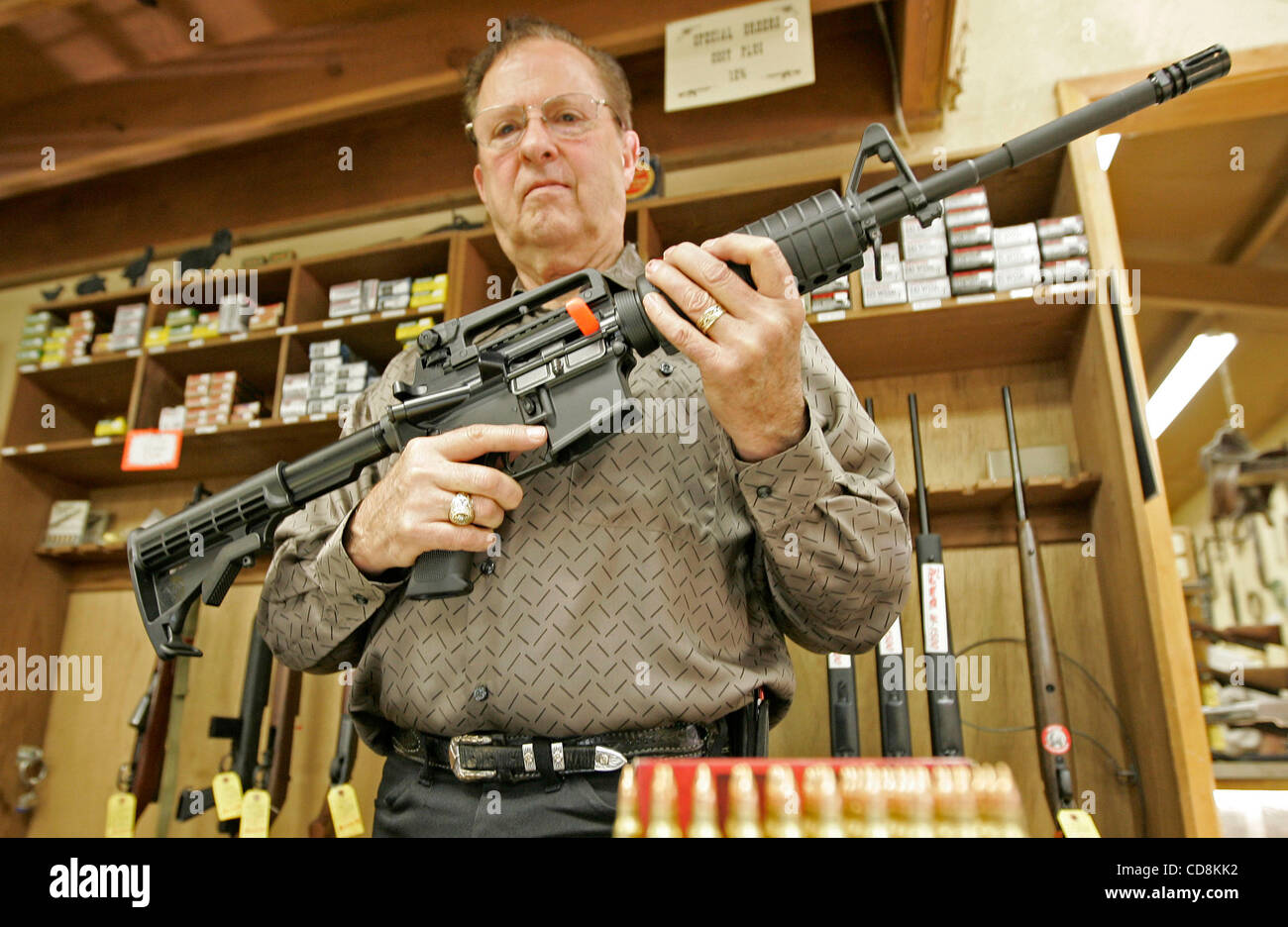 Emmett Kelly, owner of Gun Emporium in Conroe, TX holds an AR-15 semi ...