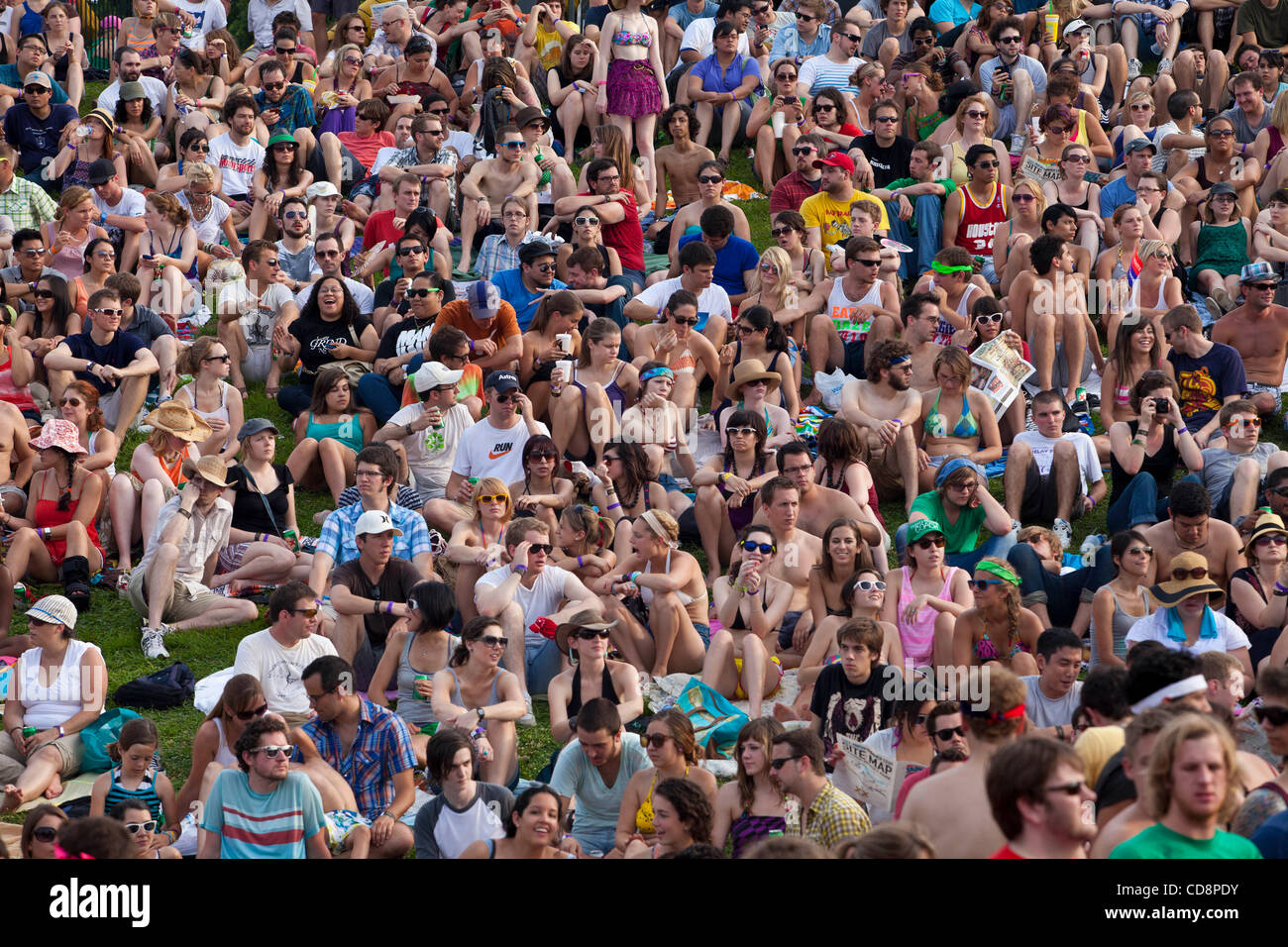 A gathered crowd watches acts perform on the main stage during day 1 of ...