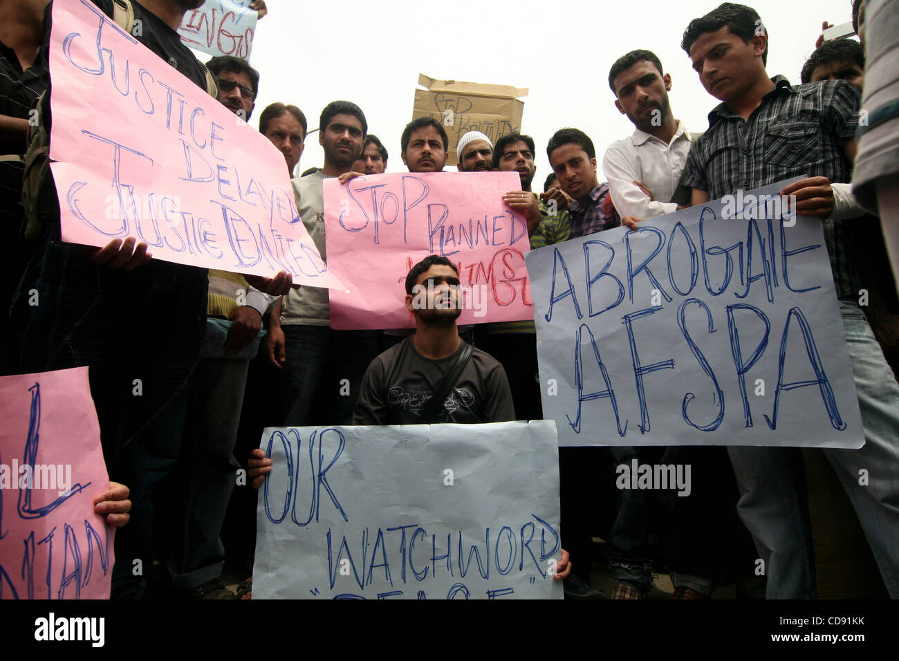 kashmiri muslim students hold ply cards during protest against killing ...