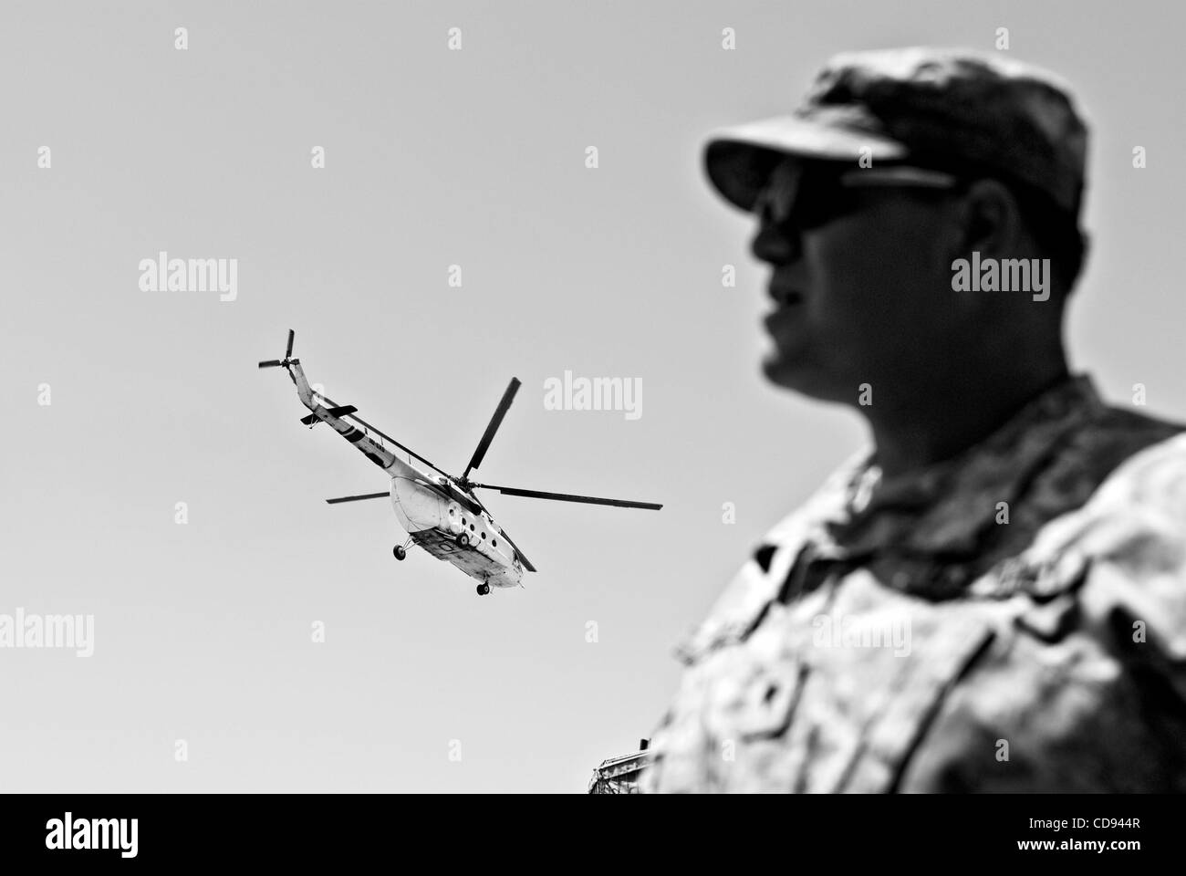 A helicopter takes off from the landing zone at Forward Operating Base ...