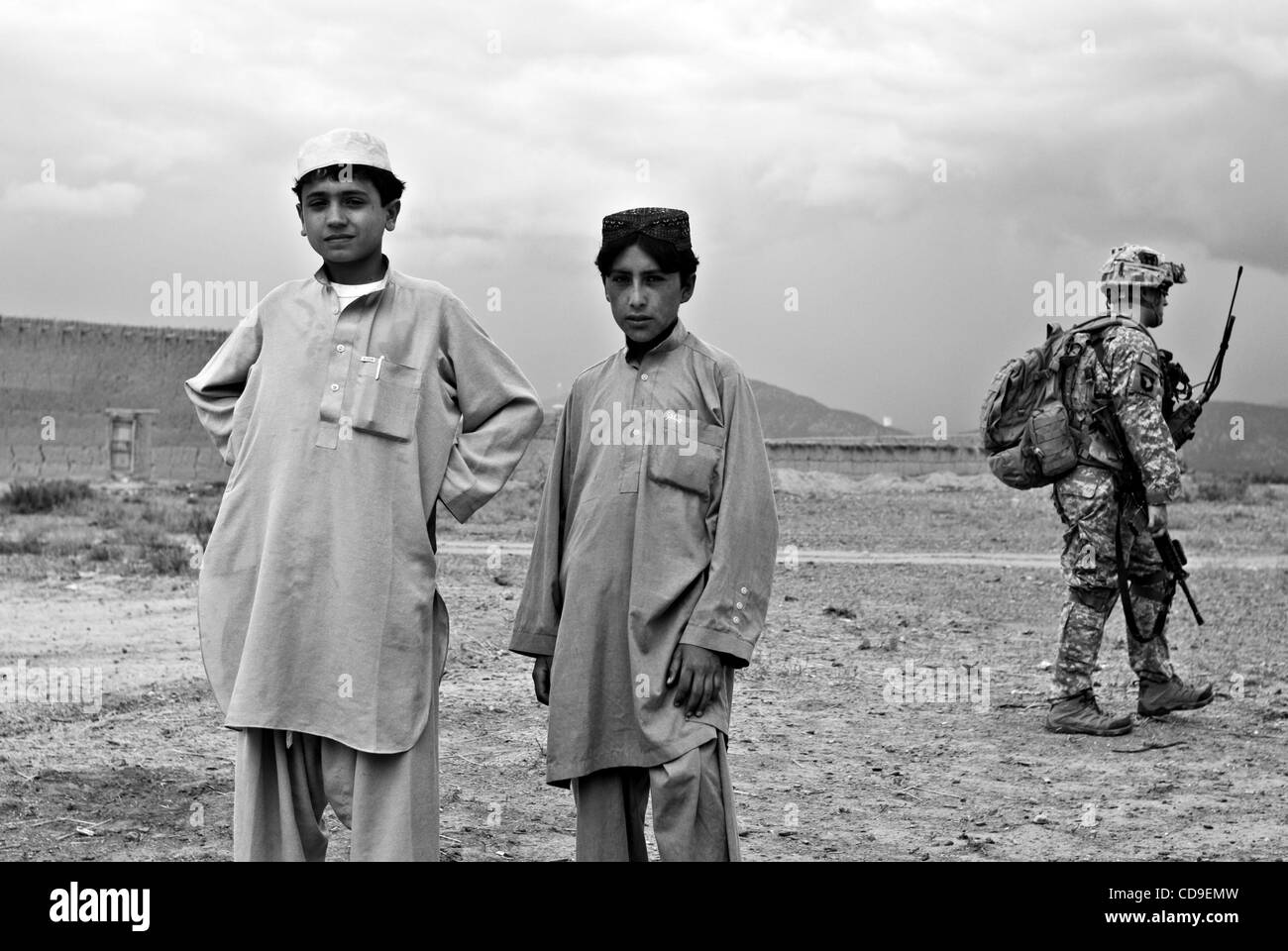 Afghan boys before a shura, or meeting, between tribal elders, Afghan ...