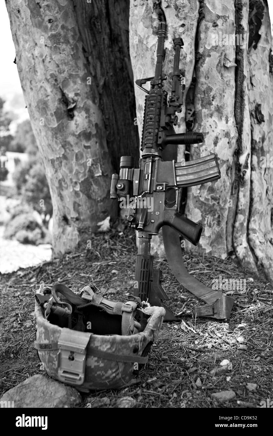 A U.S. Soldier's helmet and M4 carbine during a patrol near the Afghan ...