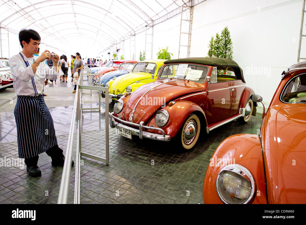 July 16, 2010 - Pathum Thani, Thailand - A man takes photos of ...