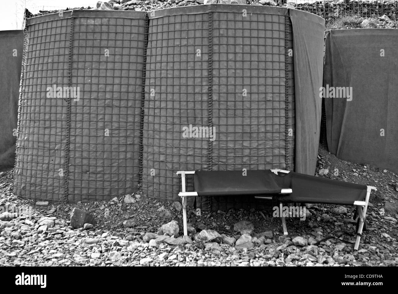 A broken cot sits outside a barracks at Forward Operating Boris Stock ...