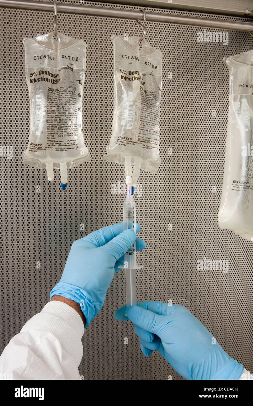 July 29, 2010 - Hollywood, Florida, US - A pharmacist works on a custom ...