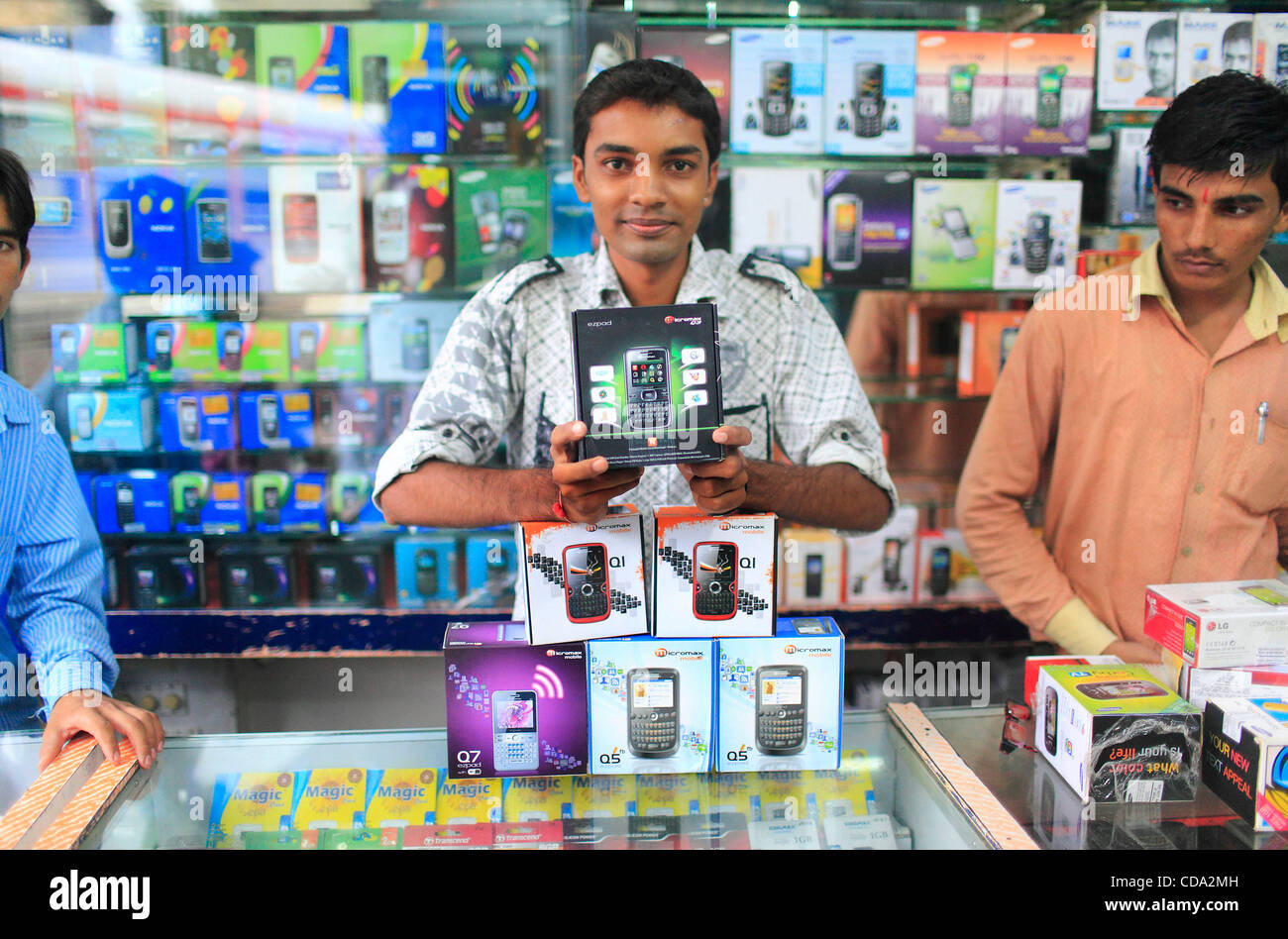 Amit Gala, A micromax mobile phone retailer in Mumbai shows the latest ...