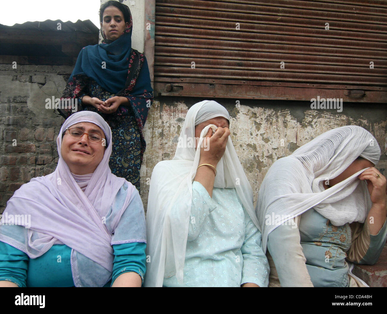 Kashmiri muslim women crying during the funeral procession of Ghulam ...