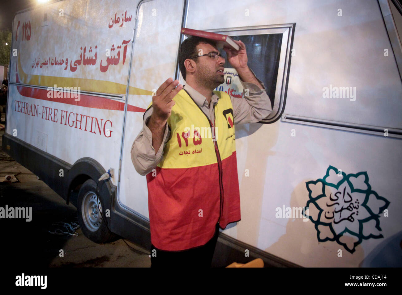 Sep 1, 2010 - Tehran, Iran An Iranian fireman holds Holy Quran on his ...