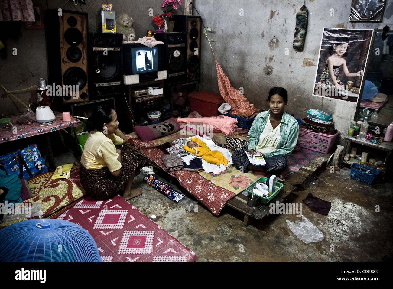 Burmese migrant family at one slum in downtown of Mae Sot Stock Photo ...