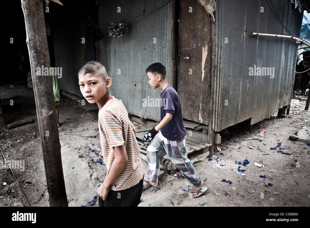 Burmese slum into the thai factory land, outskirts of Mae Sot town. At ...
