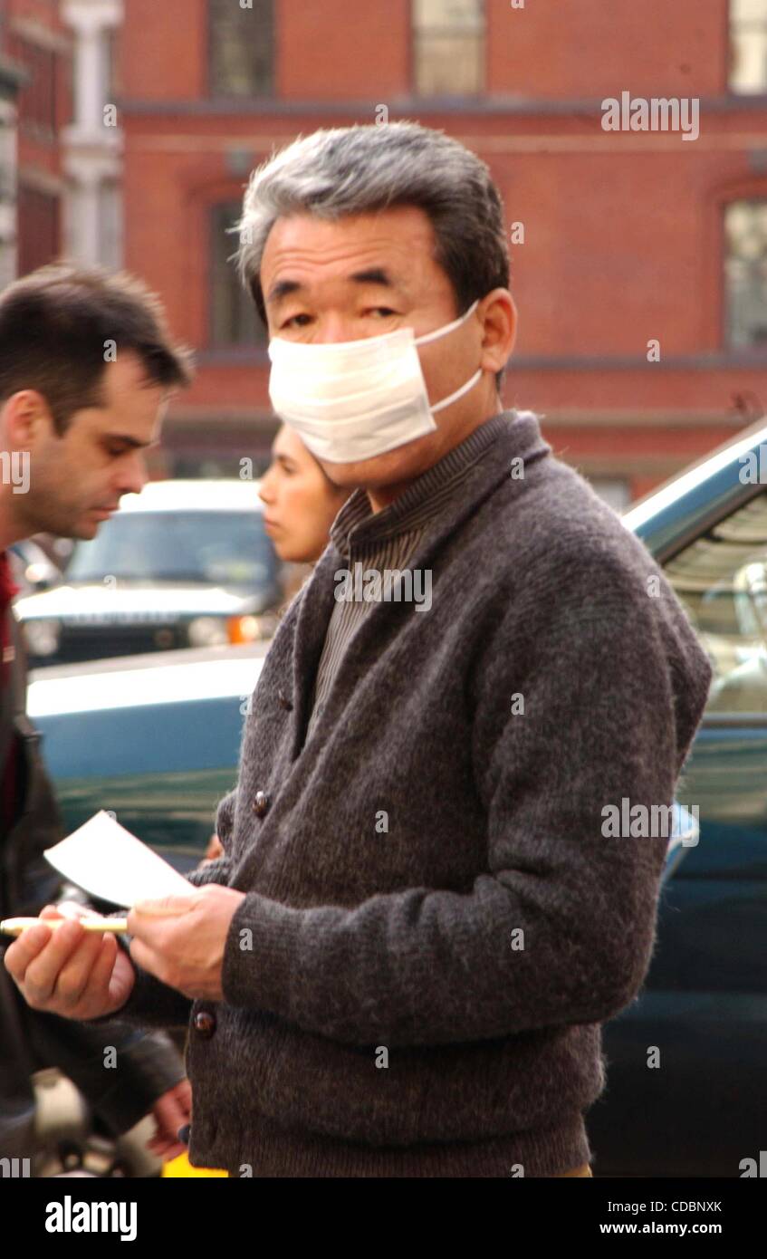 K30255AR.MAN WEARING A MASK TO GUARD AGAINST SARS IN NEW YORK' S ...