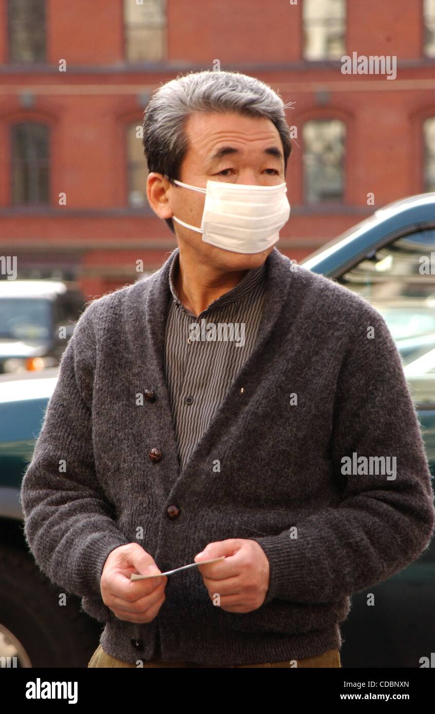 K30255AR.MAN WEARING A MASK TO GUARD AGAINST SARS IN NEW YORK' S ...