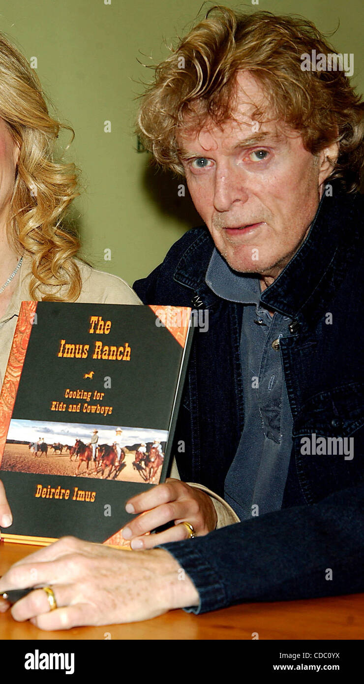 K36889AR.DON IMUS AND WIFE DEIDRE SIGN'S COPIES OF ''THE IMUS RANCH ...