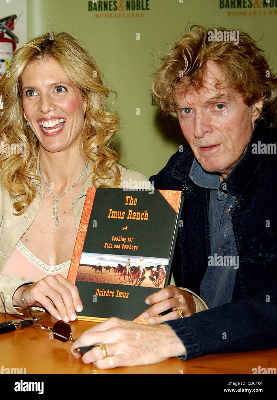 K36889AR.DON IMUS AND WIFE DEIDRE SIGN'S COPIES OF ''THE IMUS RANCH ...