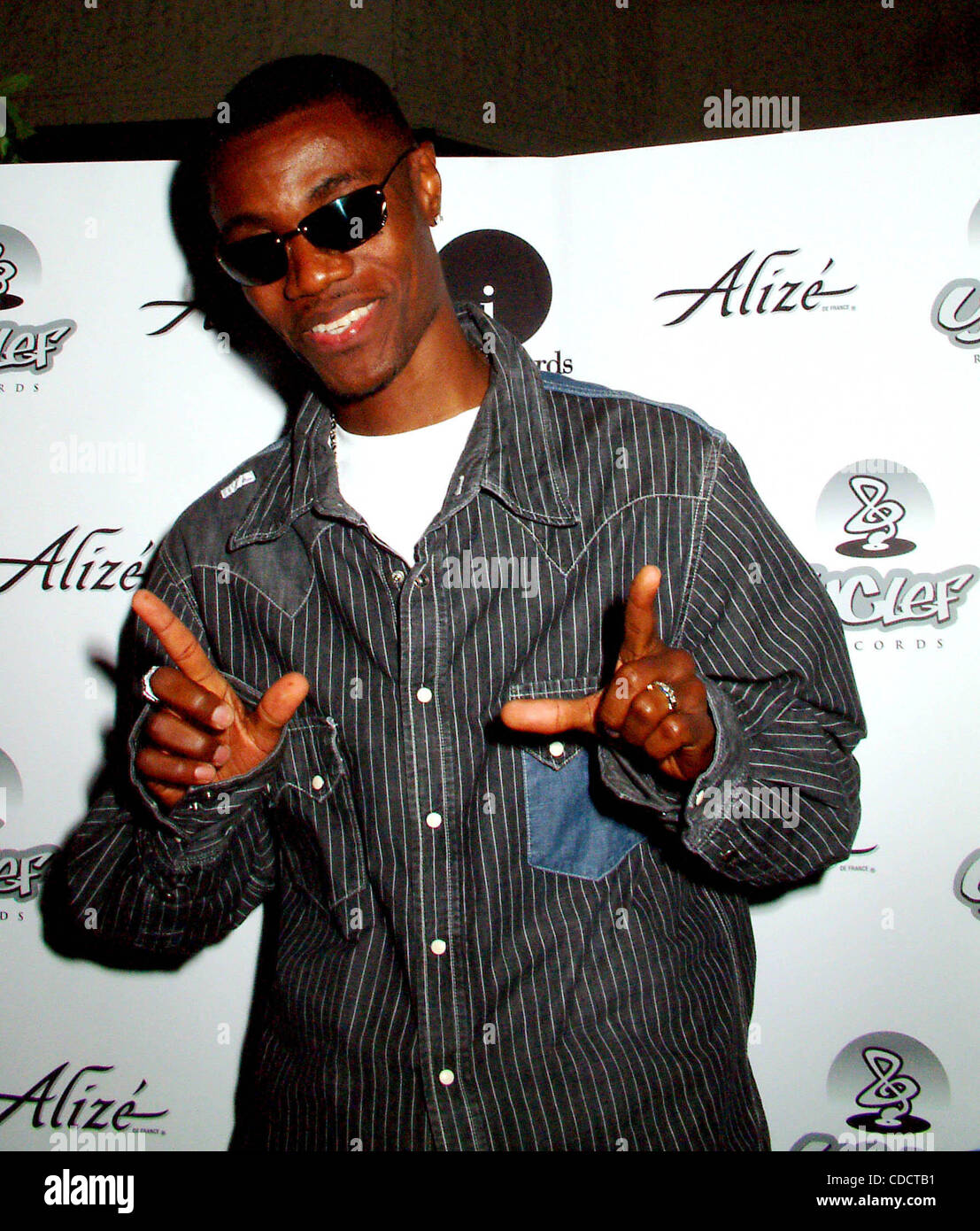 K32918ML .WYCLEF JEAN AND CLIVE DAVIS HOST THE PREACHER'S SON UNVEILING ...