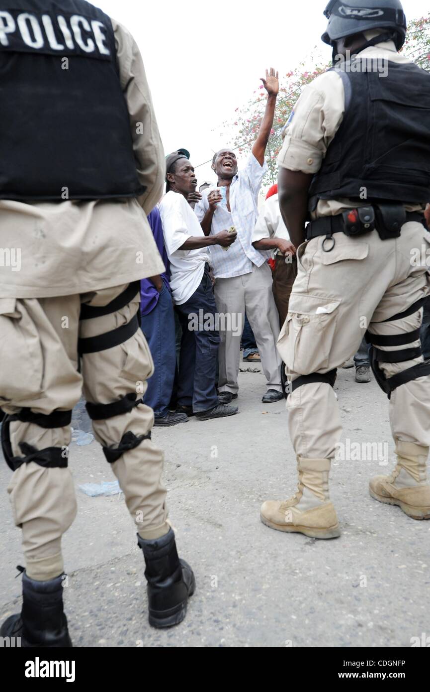 Jan 18, 2011 - Port-au-Prince, Haiti - Police stand guard as a crowd ...